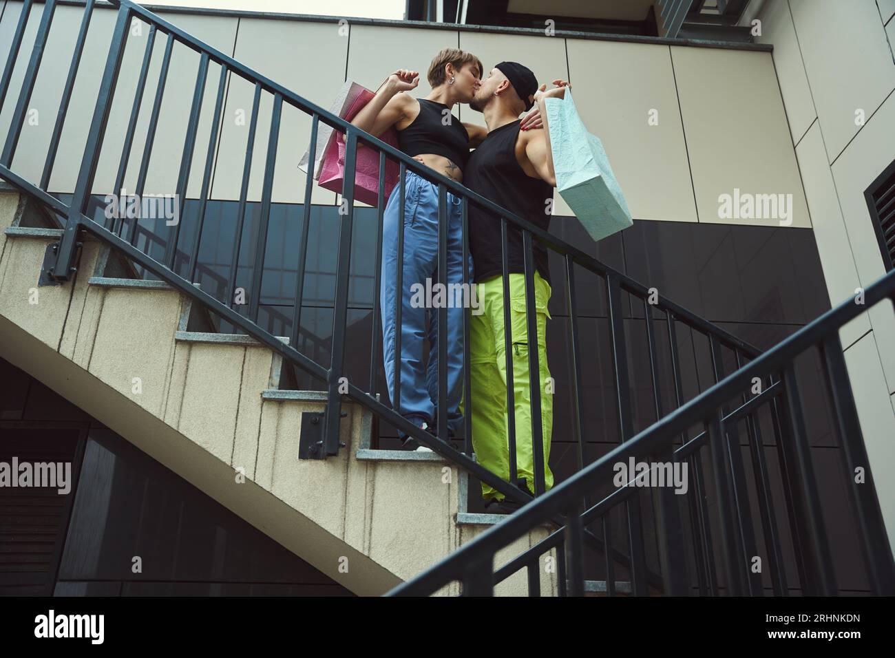 Guy and his girlfriend are kissing on the steps Stock Photo - Alamy