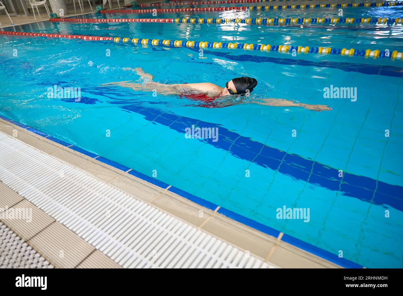 Professional swimmer practicing freestyle stroke in swimming pool Stock Photo - Alamy