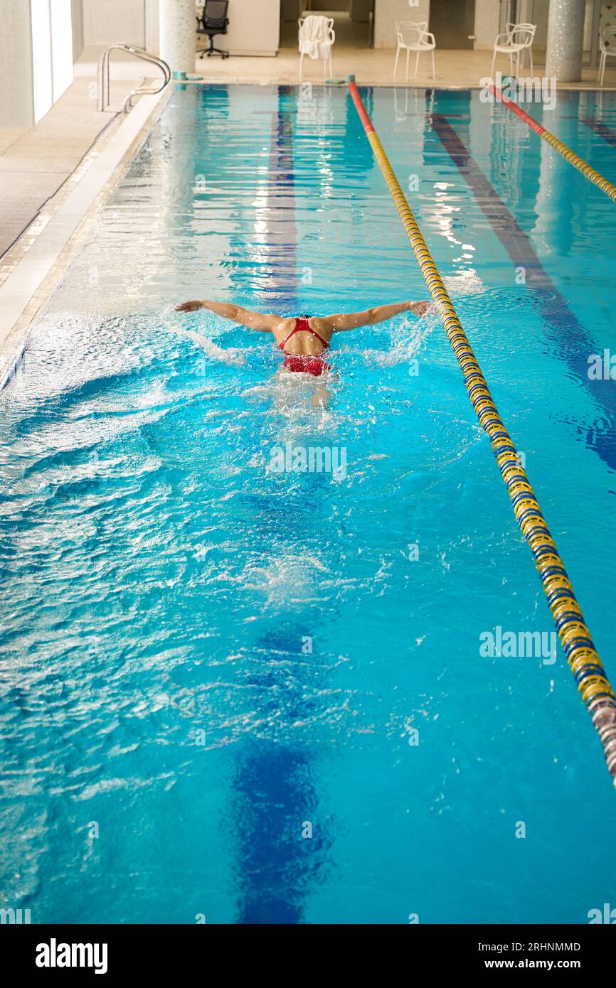 Woman swimming butterfly stroke hi-res stock photography and images - Alamy