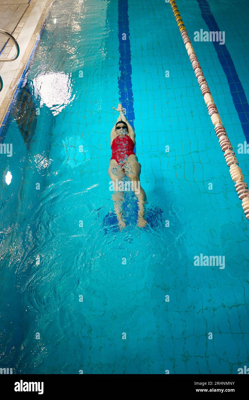Professional swimmer doing underwater workout in indoor pool Stock ...