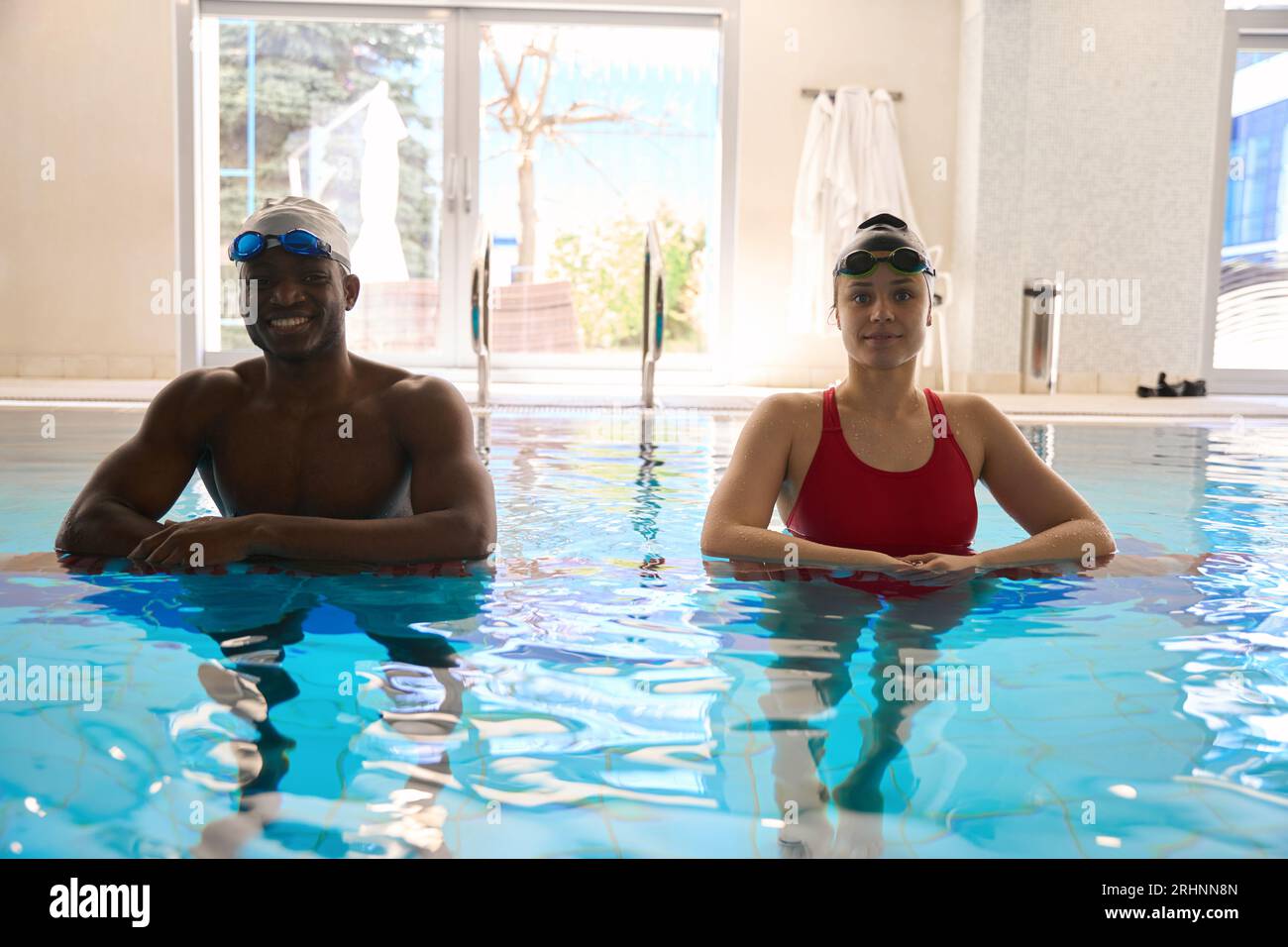 Two female swimmers in pool hi-res stock photography and images - Alamy