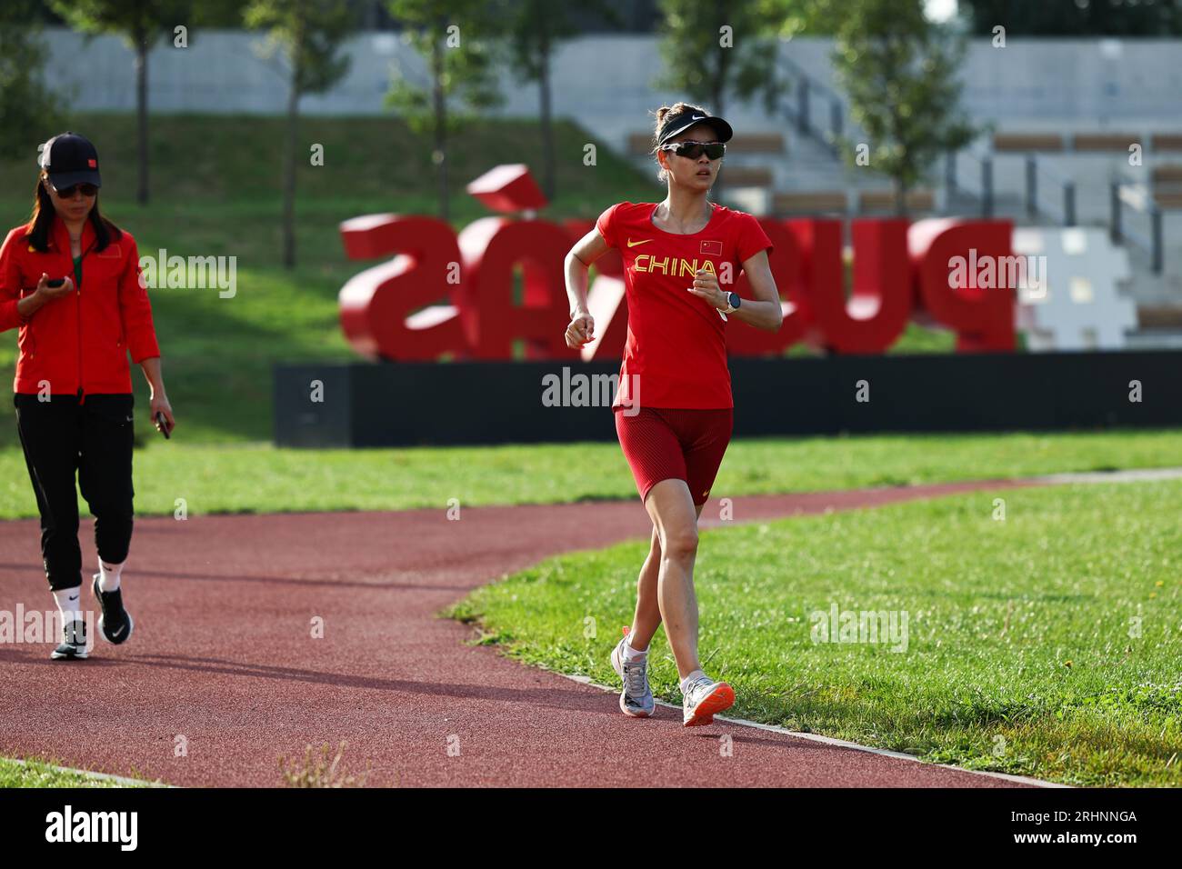 Budapest. 18th Aug, 2023. Racewalking athlete Yang Jiayu (R) of China ...