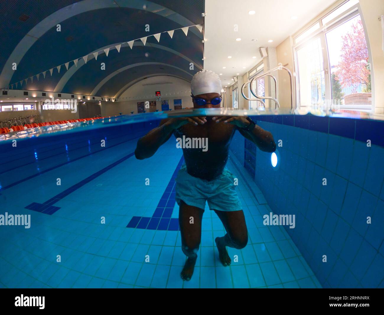 Sportsman is practicing total immersion swim technique in pool Stock ...