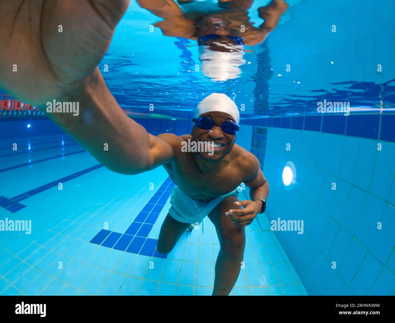 Swimmer enjoying his underwater training in swimming pool Stock Photo ...