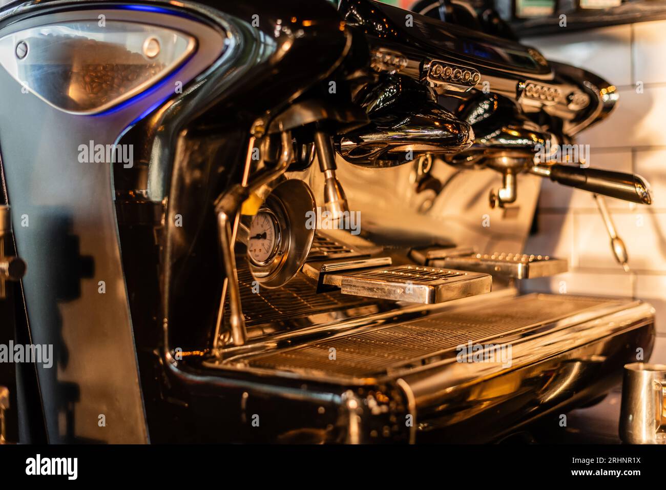 close up view of coffee machine with sunlight on worktop in coffee shop ...