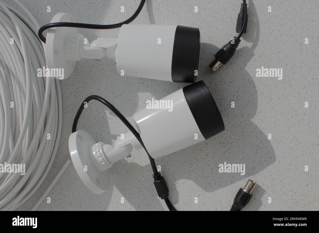 Detail of security camera with coil of wire, representing constant ...