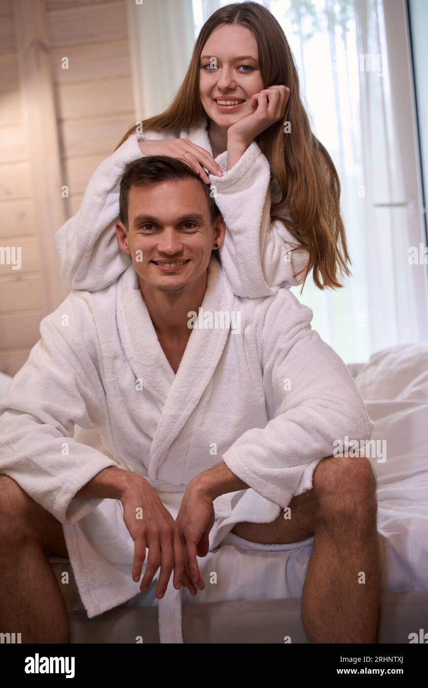 Woman sitting edge bed man hi-res stock photography and images - Alamy