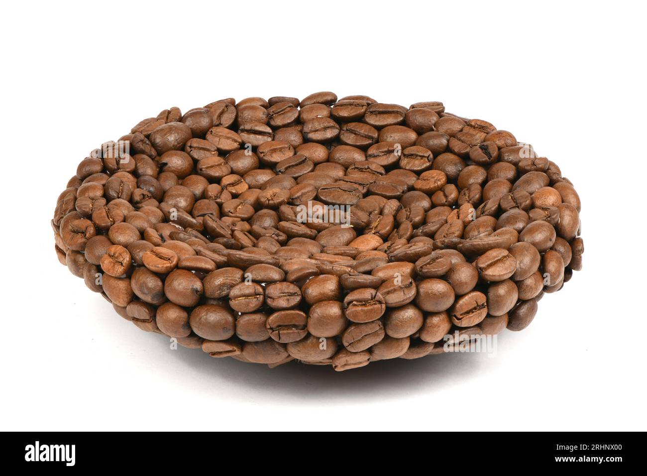 Coffee plate made from roasted coffee beans. Coffee beans are glued ...