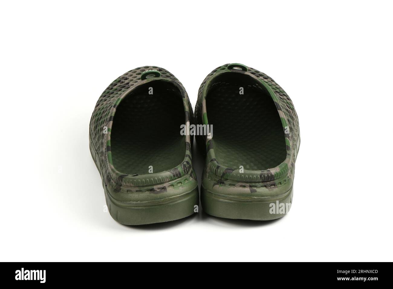 Pair dark green galoshes isolated on a white background. Shoes for ...