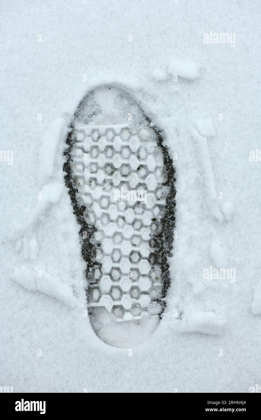 Top view of the footprint of shoes boots on fresh snow. High resolution ...
