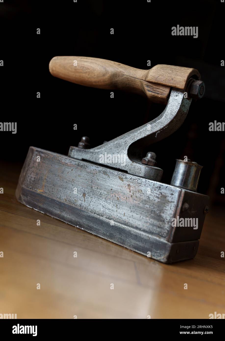 Old Corroded And Aged Iron With Wooden Handle On Wooden Floor Stock ...