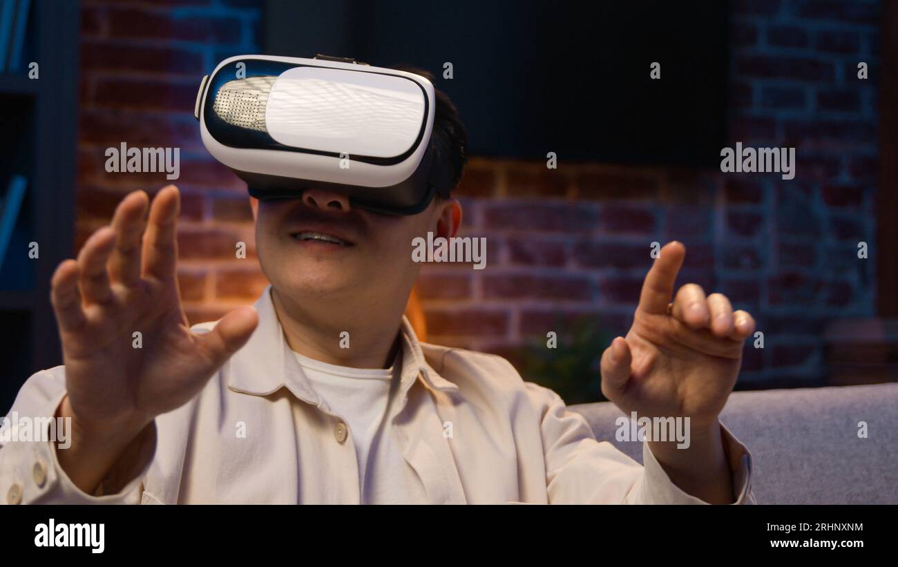 Asian man play video game virtual reality experience cyberspace world ...