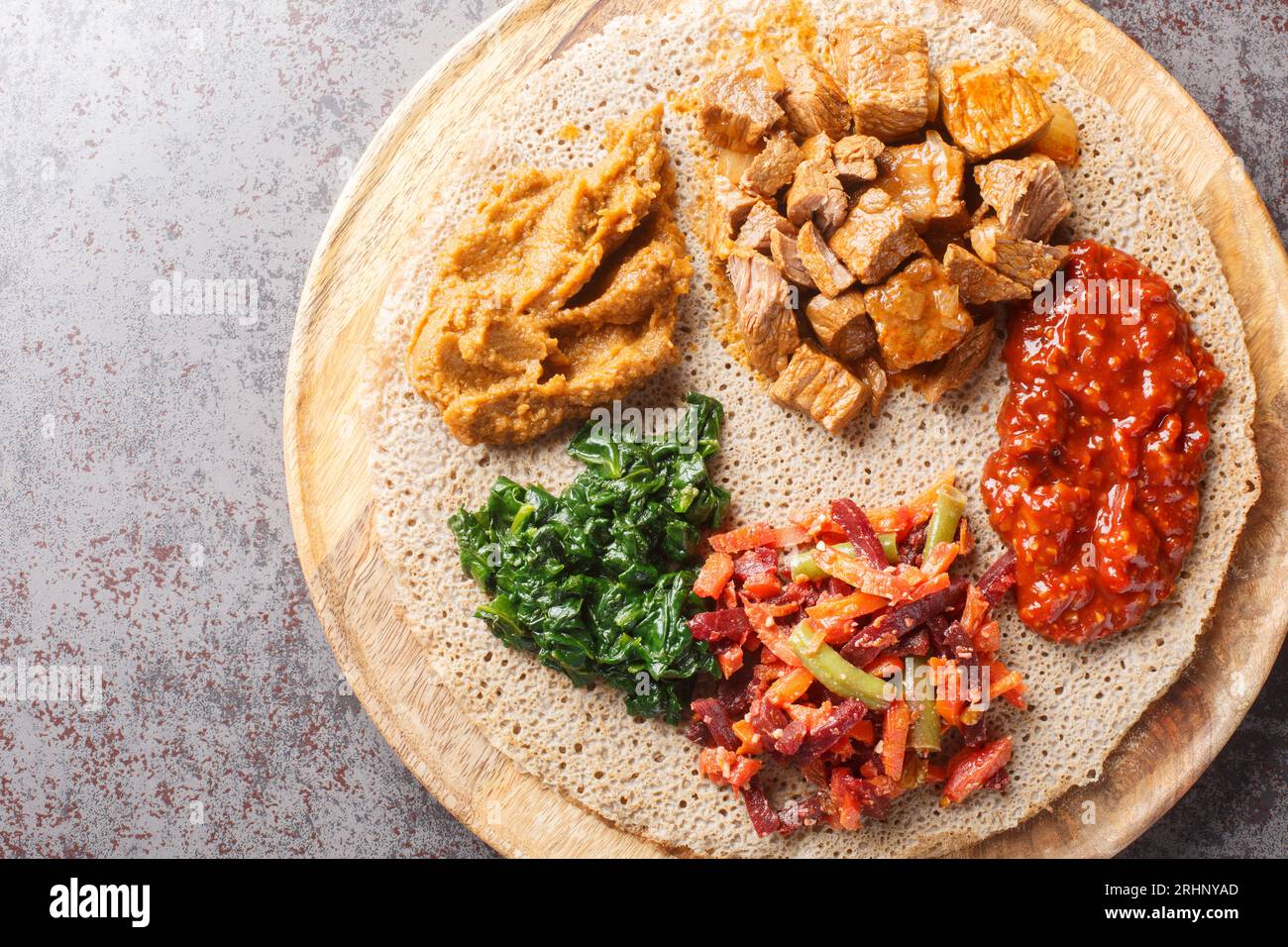 Ethiopian Injera flat bread with various vegetable and meat fillings ...