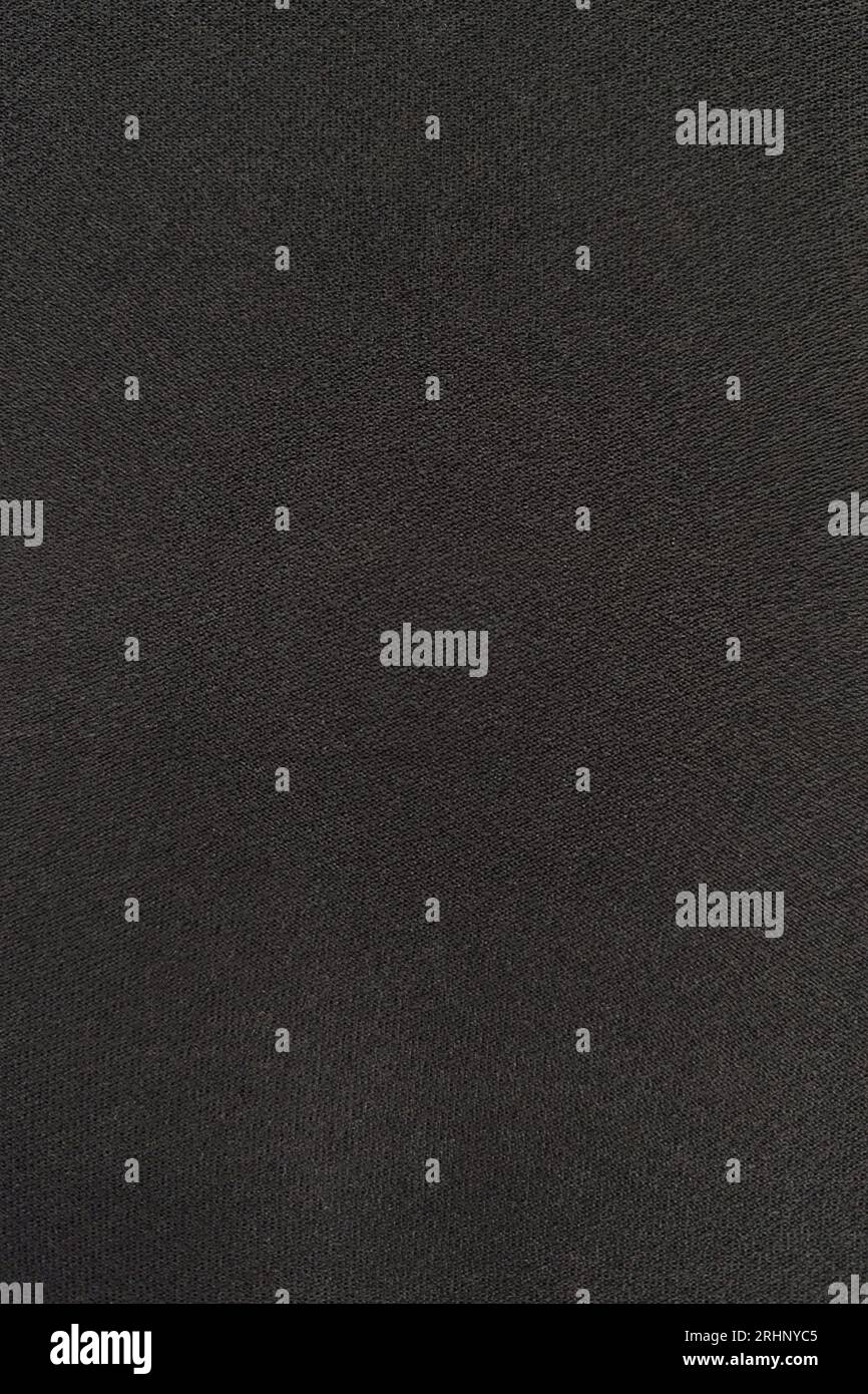 Detailed texture of black woolen cloth surface. Abstract background or ...