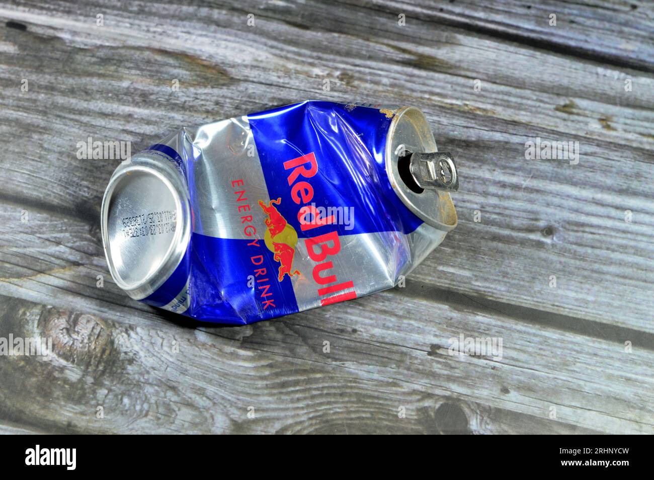 Cairo, Egypt, July 28 2023: Crushed dented Red Bull energy drink, a ...