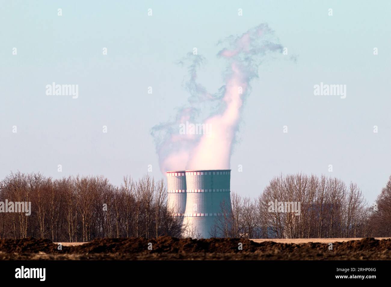 The cooling towers of a thermal power plant emit clouds of steam (a ...