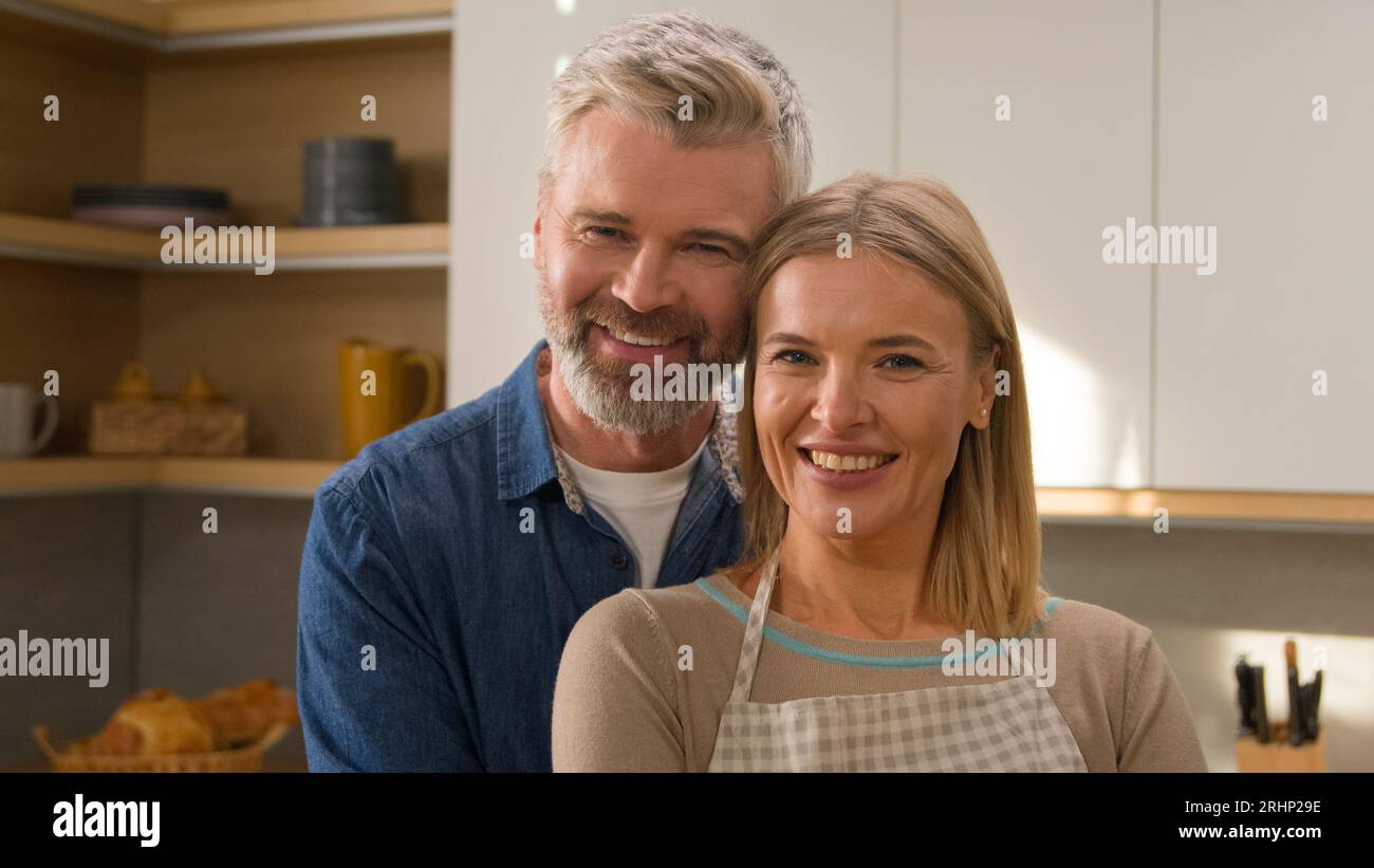 Happy family portrait at home cooking kitchen adult Caucasian couple ...
