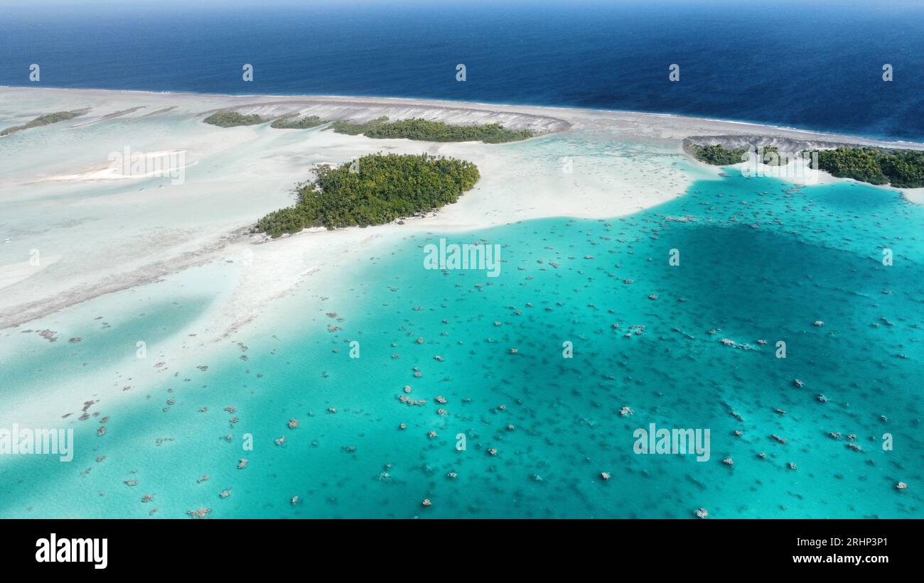 Aerial view of the stunning blue lagoon at Rangiroa Atoll; French ...