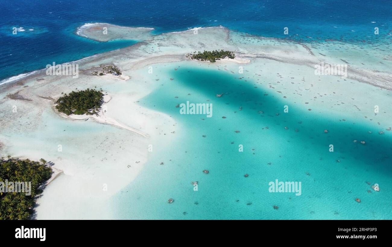 Aerial view of the stunning blue lagoon at Rangiroa Atoll; French ...