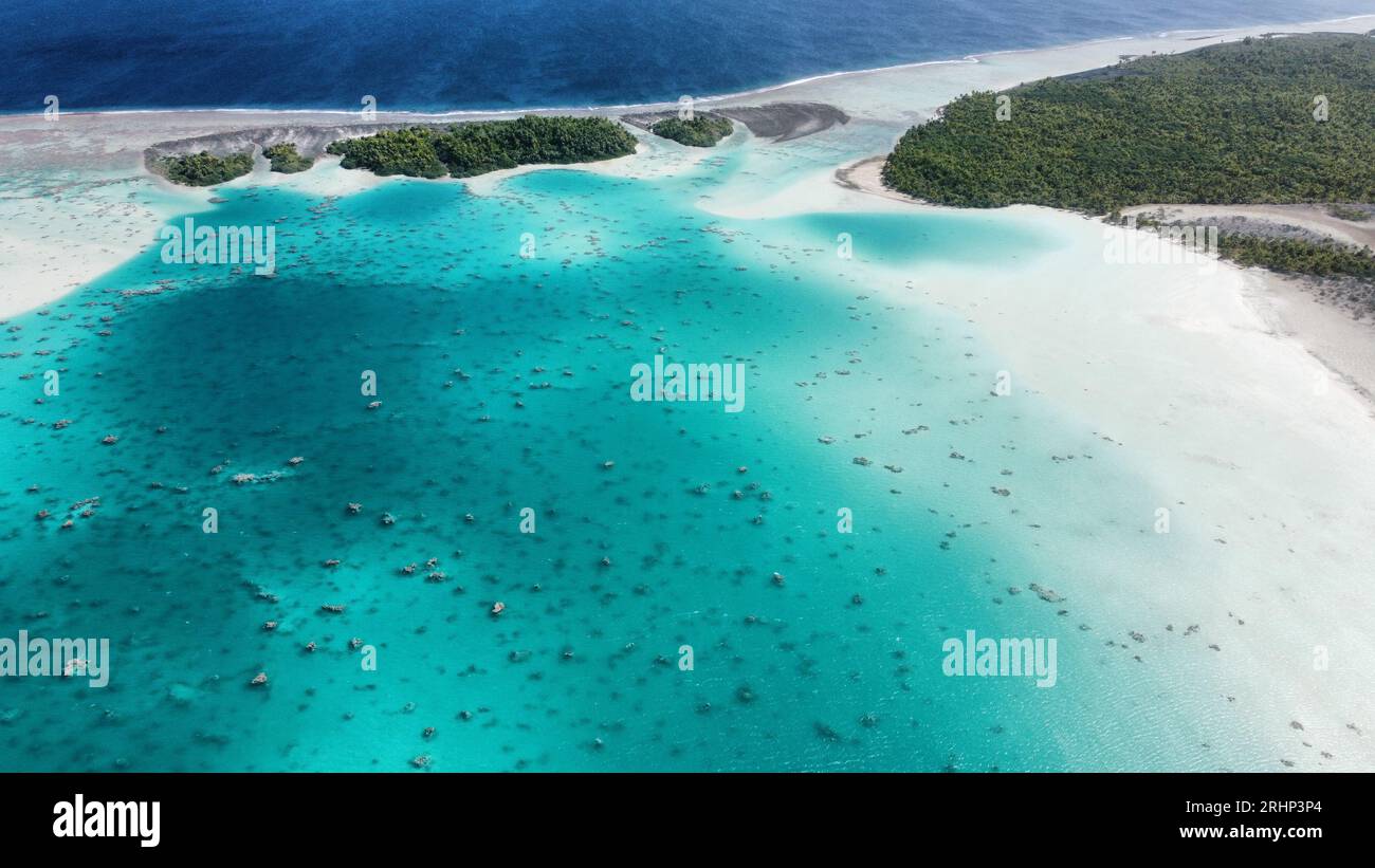 Aerial view of the stunning blue lagoon at Rangiroa Atoll; French ...