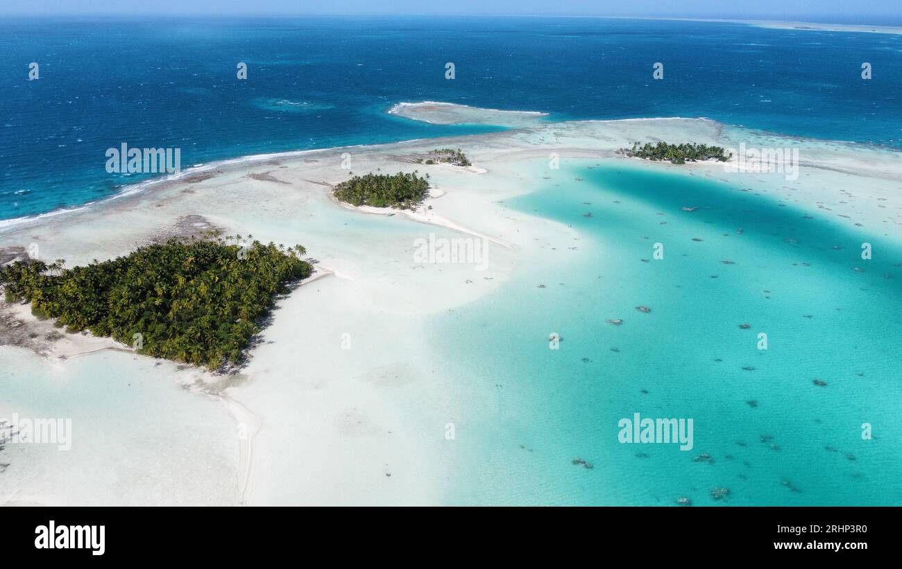 Aerial view of the stunning blue lagoon at Rangiroa Atoll; French ...