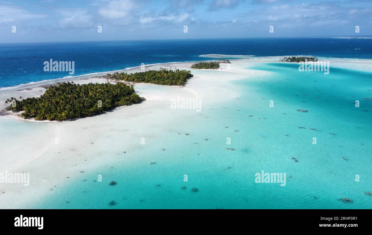 Aerial view of the stunning blue lagoon at Rangiroa Atoll; French ...