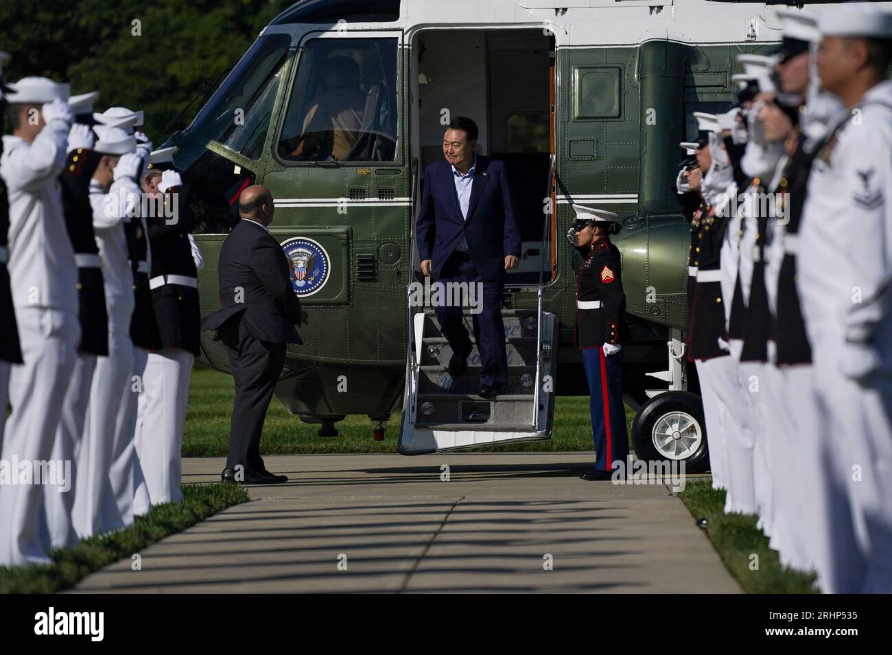 South Korean President Yoon Suk Yeol is greeted by Ethan Rosenzweig as ...