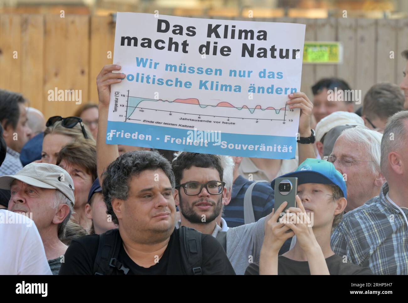 Munich, Germany. 18th Aug, 2023. Demonstrators hold placards before the ...