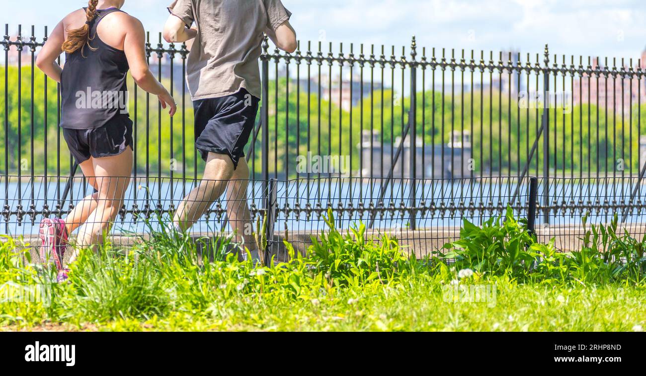 Healthy fit and sportive couple running in nature at summer day Stock ...