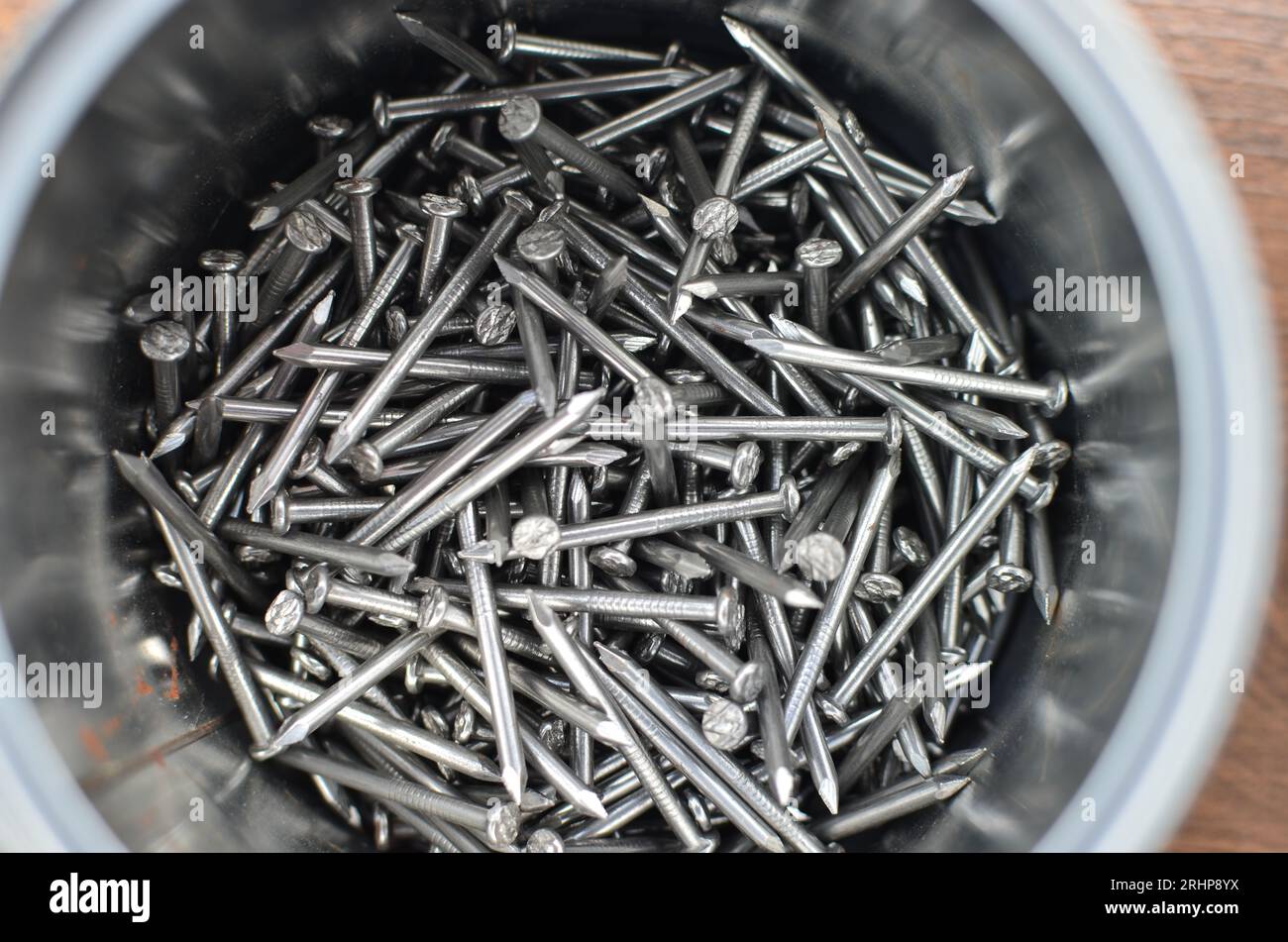 Detailed closeup of several steel nails, perfect for illustrating or ...