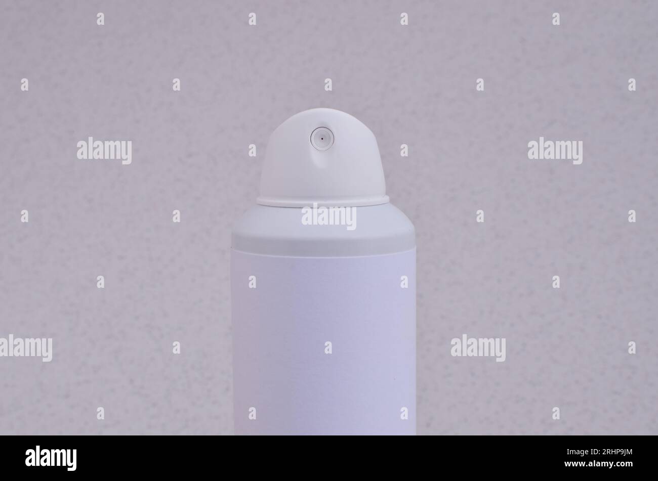 Close-up of spray deodorant with white label, conveying concepts of ...