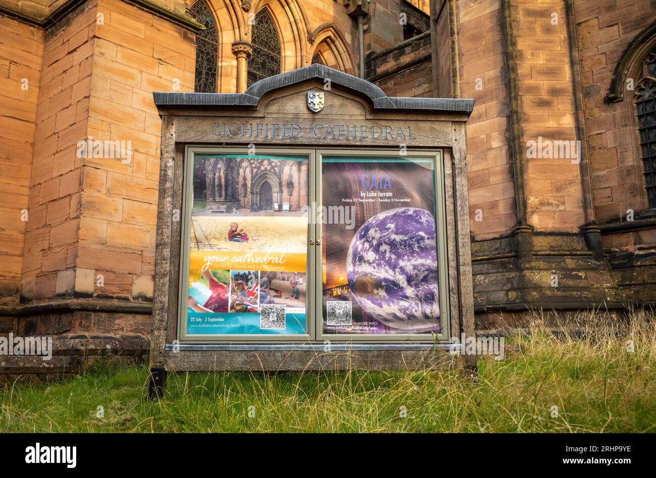 A wooden noticeboard carved with the words "Lichfield Cathedral" in the ...
