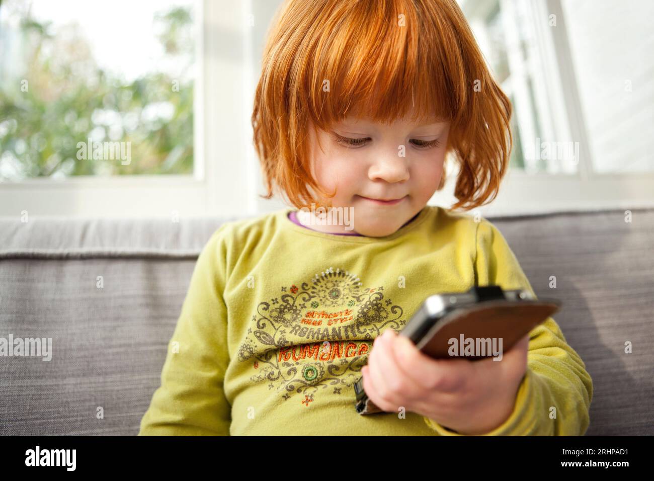 Child with smartphone Stock Photo - Alamy