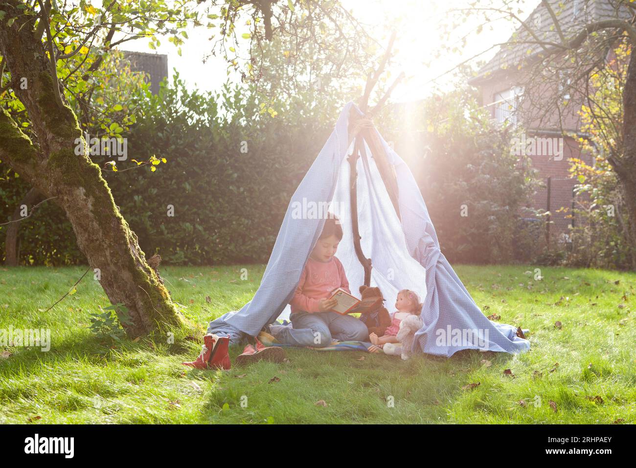 Girl in self made tent Stock Photo - Alamy