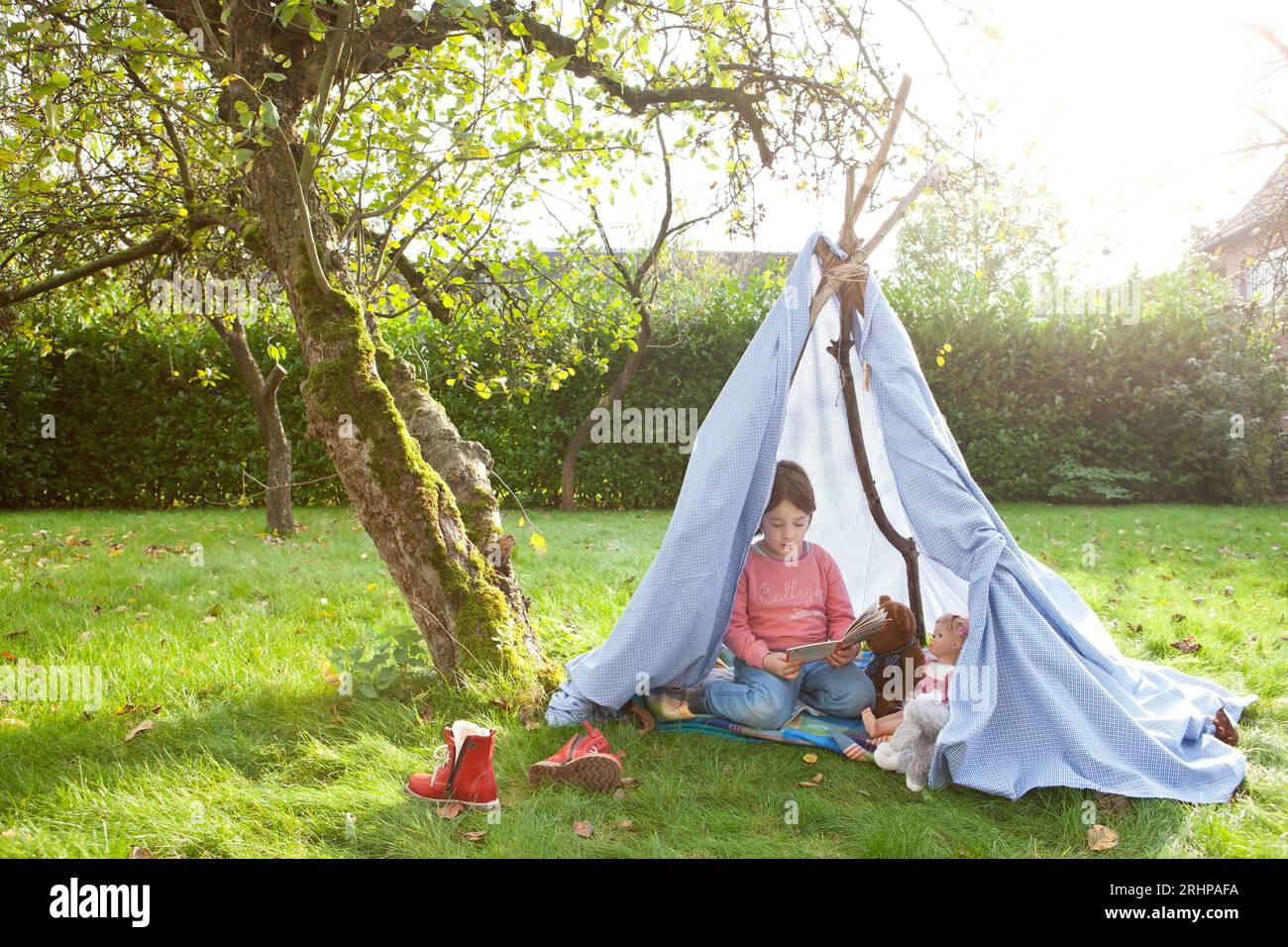 Girl in self made tent Stock Photo - Alamy