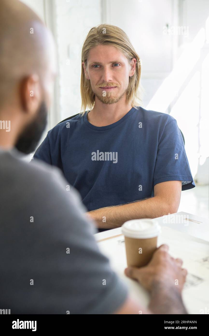 Men in conversation Stock Photo - Alamy