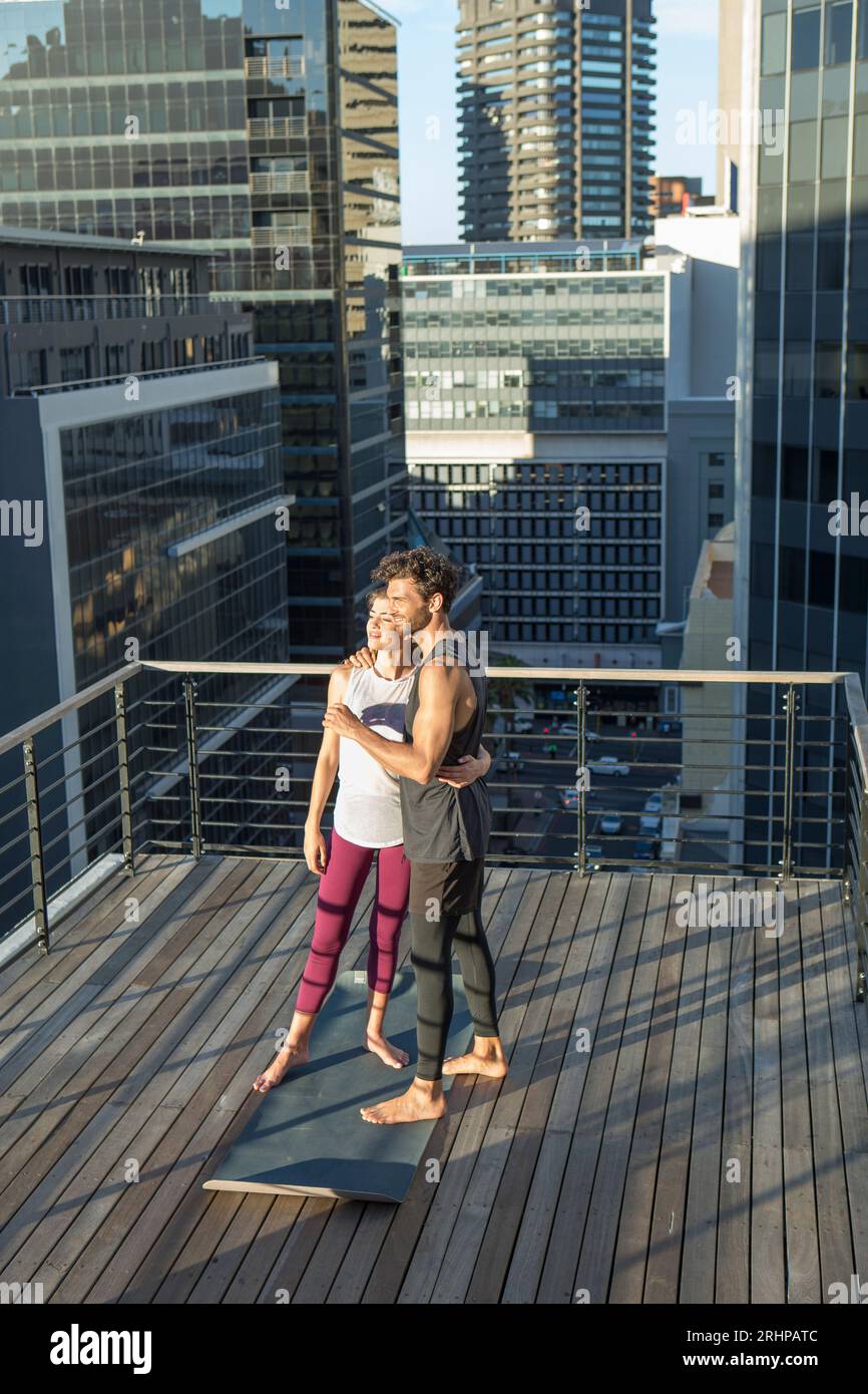 Couple on roof terrace Stock Photo - Alamy