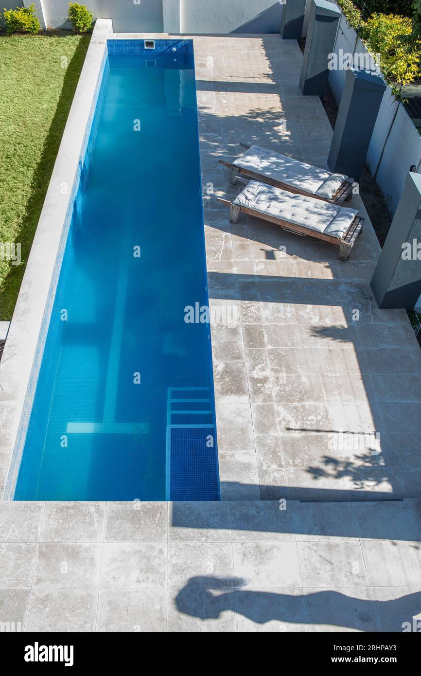 Pool with sun loungers Stock Photo - Alamy