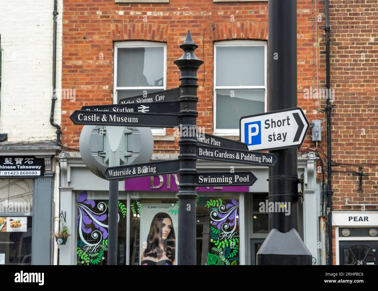 Tourist signpost pointing way to various attractions in Knaresborough ...