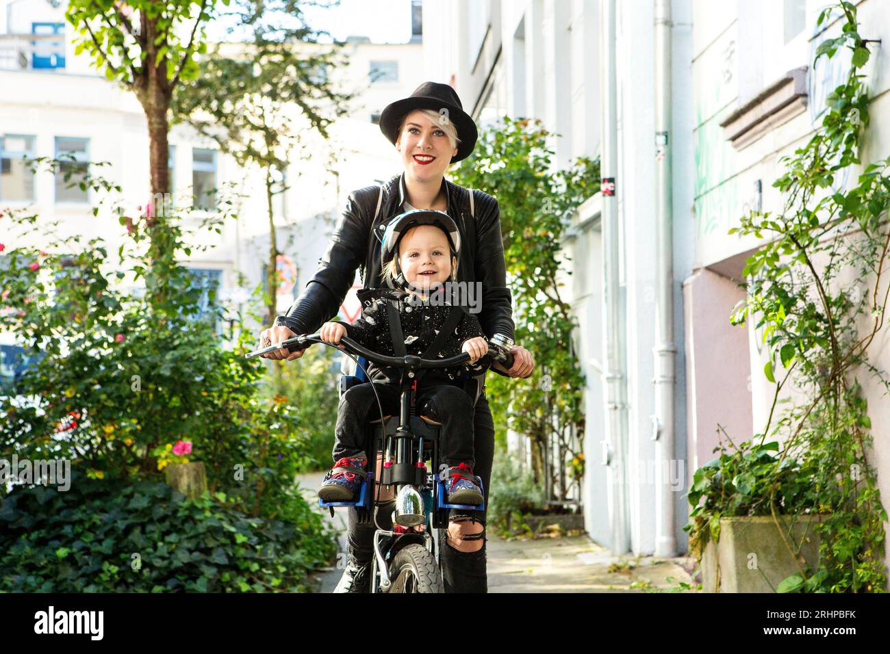 Mother and son on bicycle Stock Photo - Alamy