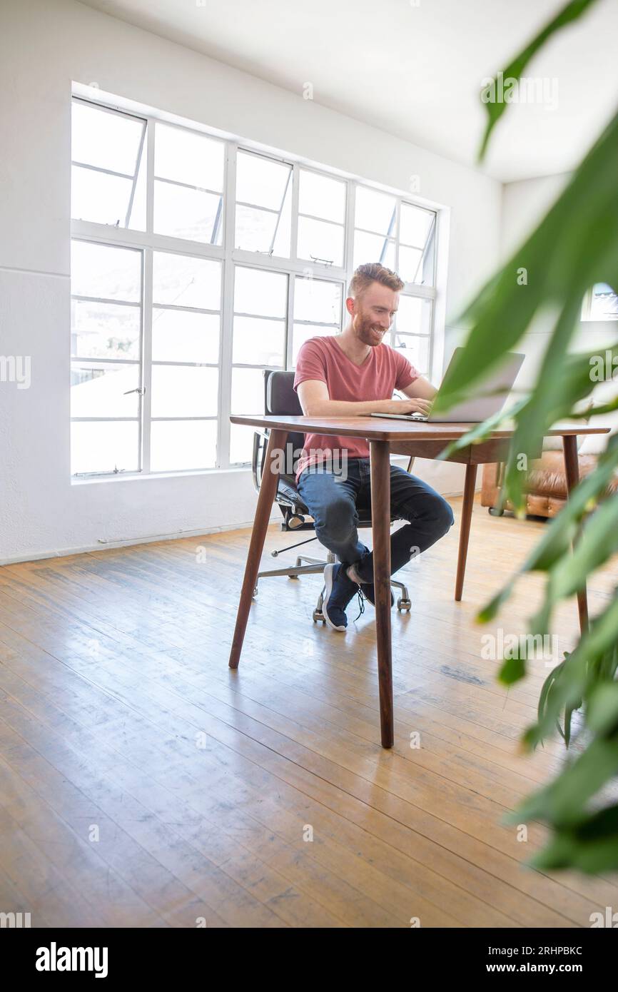 Young man beard desk hi-res stock photography and images - Alamy