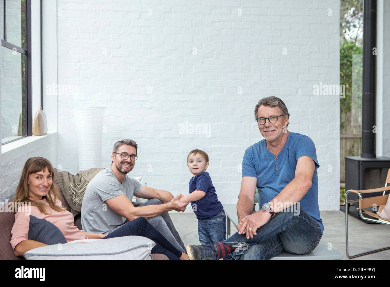 Three generations at home living together hi-res stock photography and ...