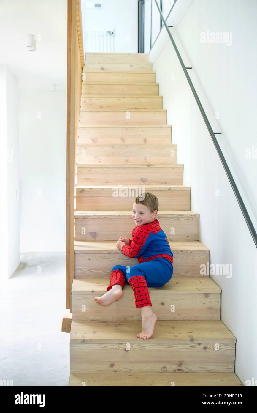 little boy sitting on stairs Stock Photo - Alamy