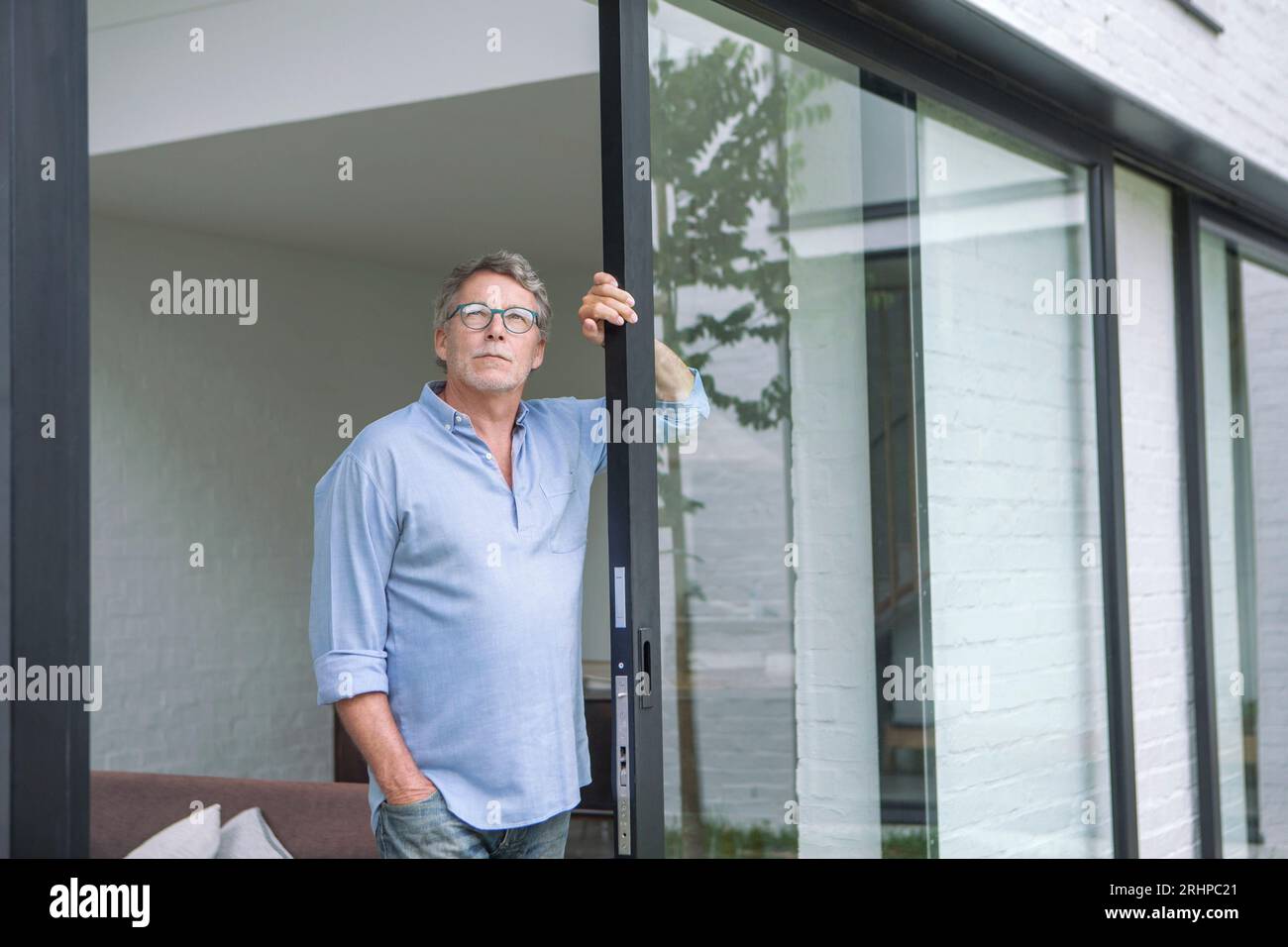 Older man at window Stock Photo - Alamy