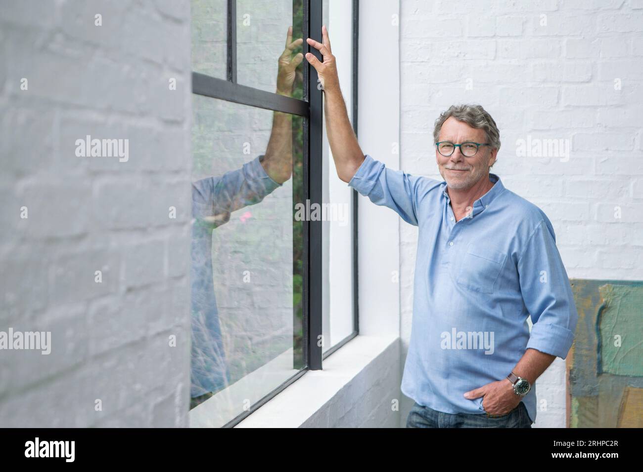 Older man at window Stock Photo - Alamy