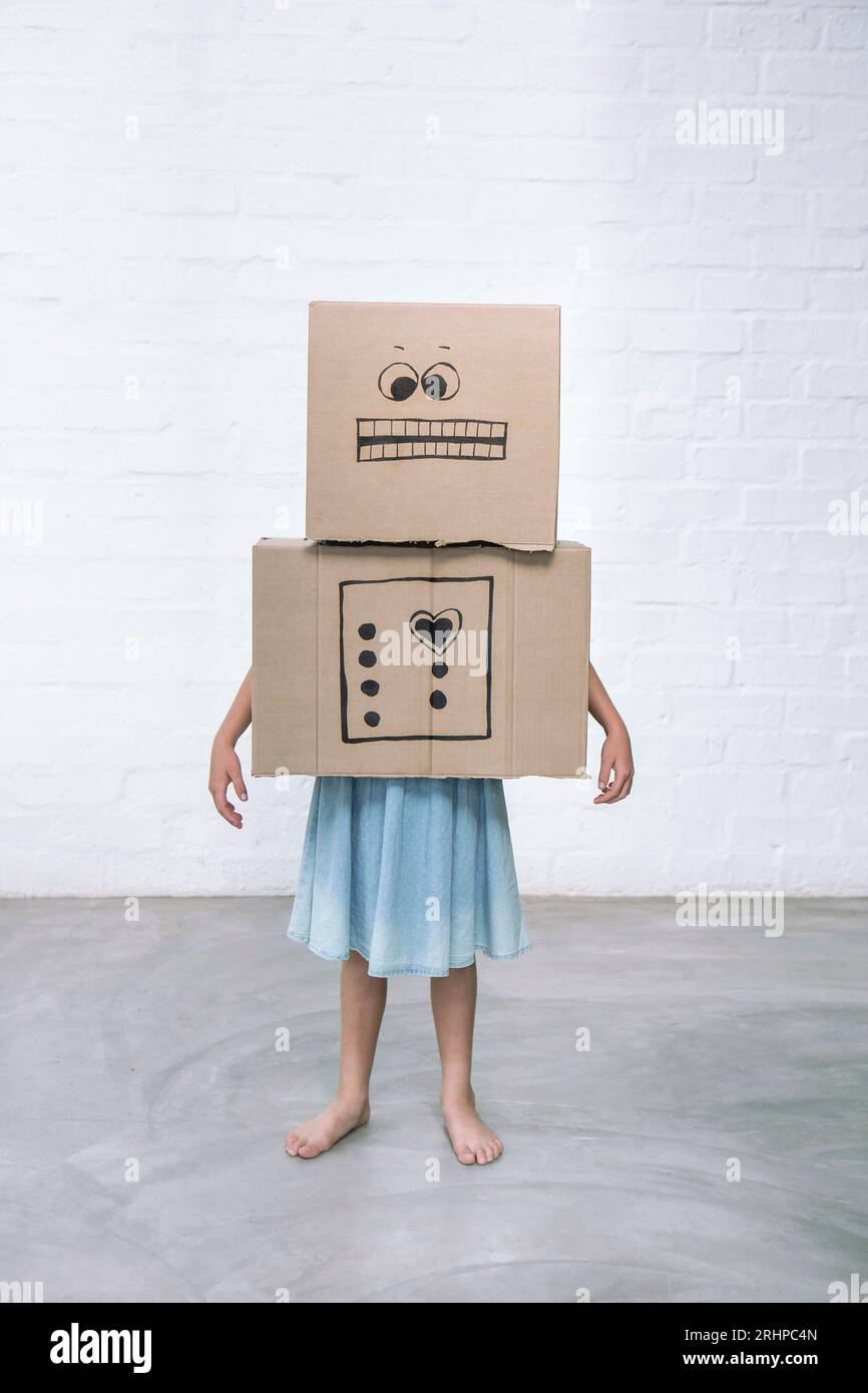 Girl dressed as cardboard monster Stock Photo - Alamy