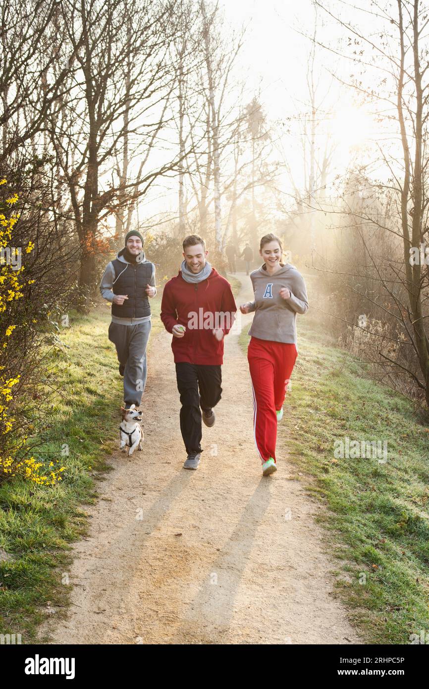 Young people jogging Stock Photo - Alamy