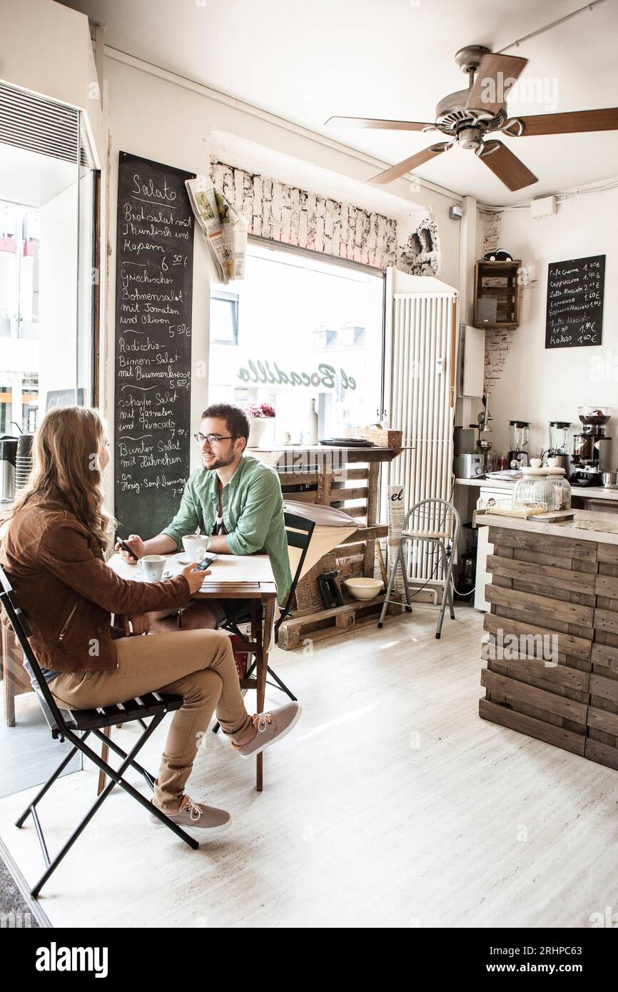 Young people in cafe Stock Photo - Alamy