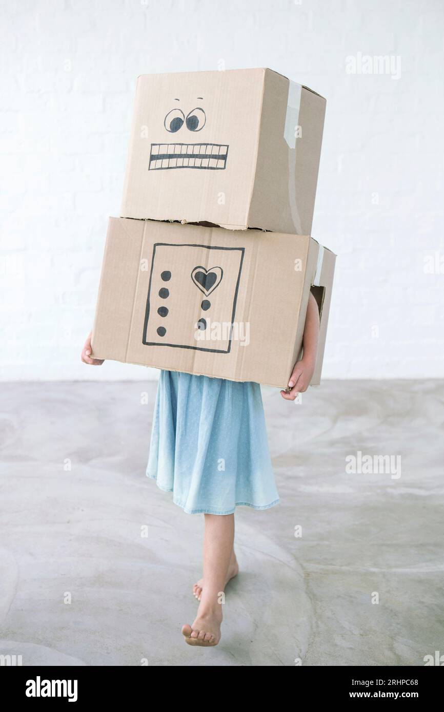 Girl dressed as cardboard monster Stock Photo - Alamy