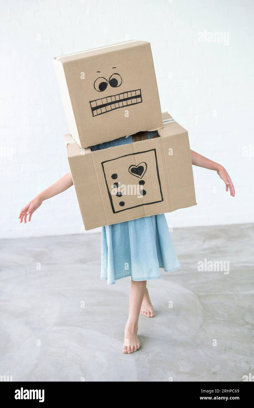 Girl dressed as cardboard monster Stock Photo - Alamy